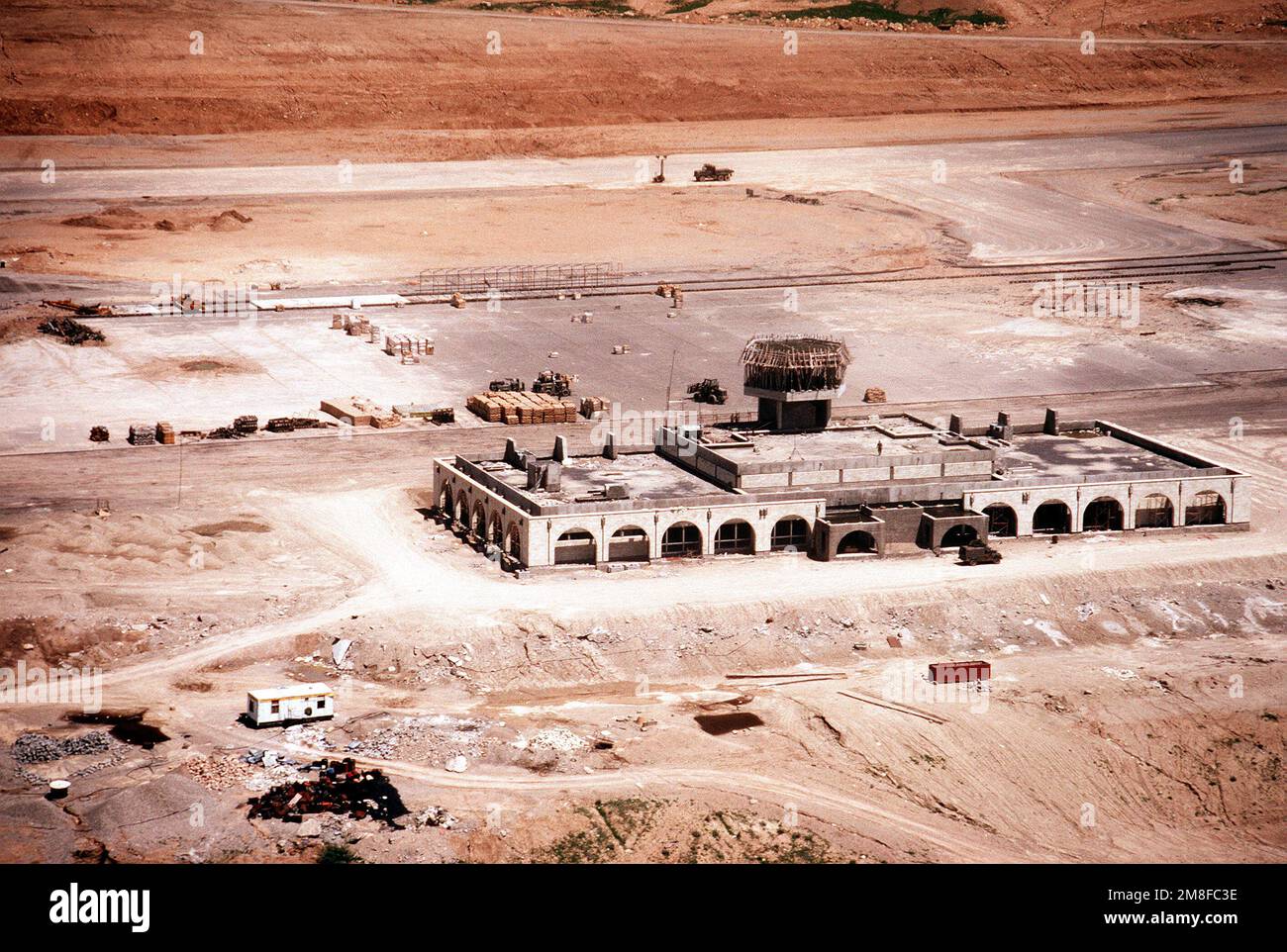 An aerial view of the terminal building at an Iraqi airfield. The ...