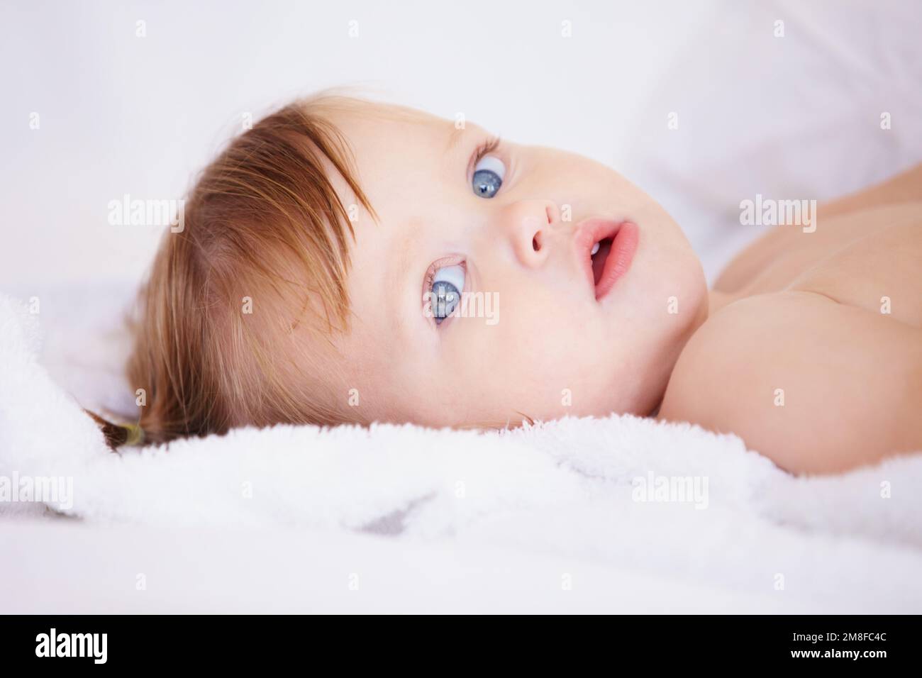 Precious little angel. A cute little girl looking at the camera Stock ...