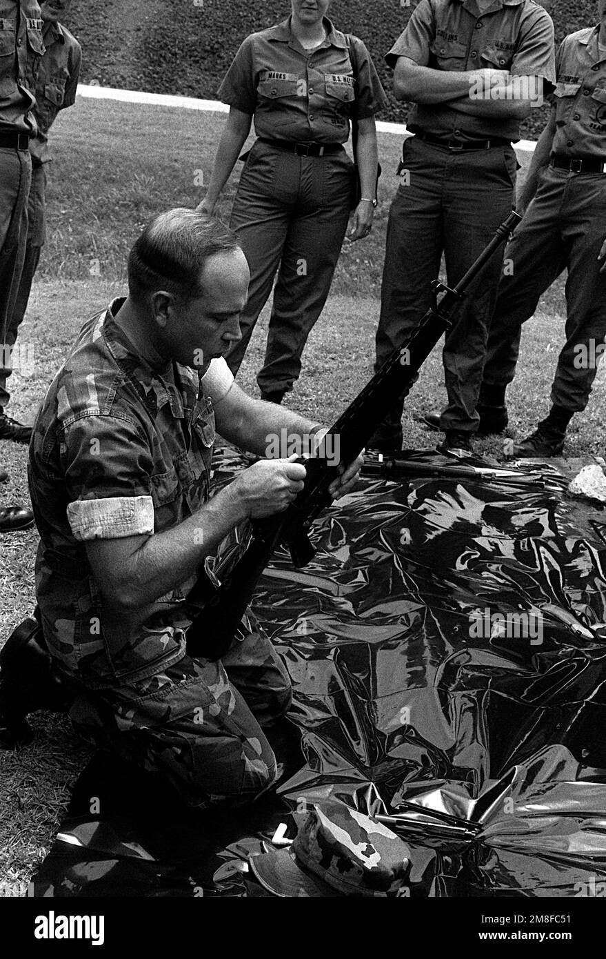 A Marine first sergeant acting as a judge during the Reserve Naval ...