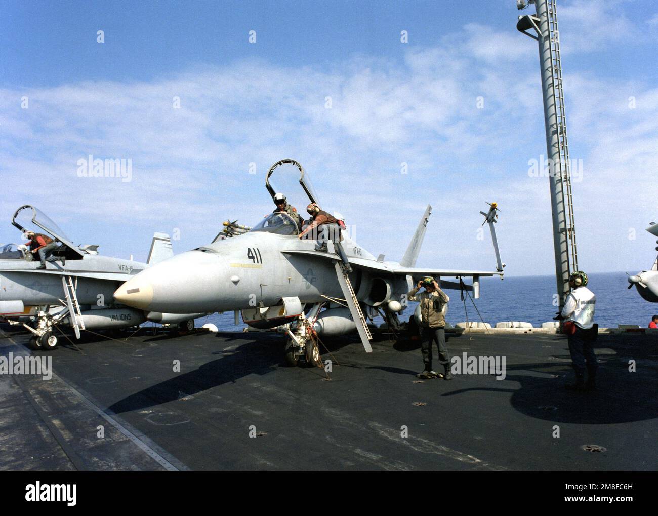 Pilots from Strike Fighter Squadron 15 (VFA-15), left, and Strike Fighter Squadron 87 (VFA-87 ...
