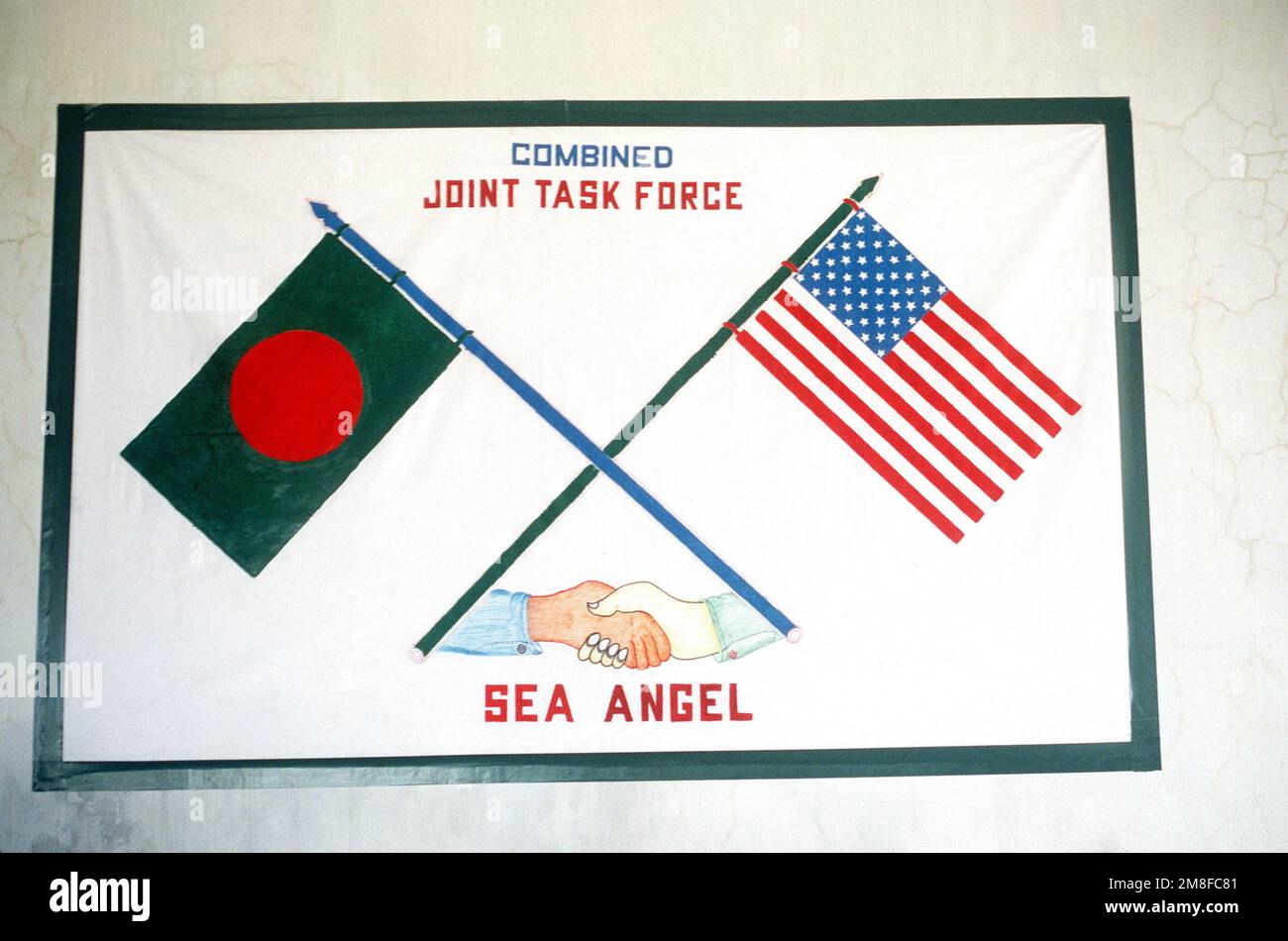 The flags of Bangladesh and the United States are depicted on a sign ...