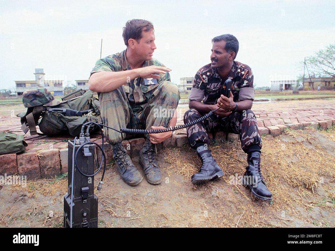 TSGT K.J. Jones converses with a Bangali army officer during Operation ...