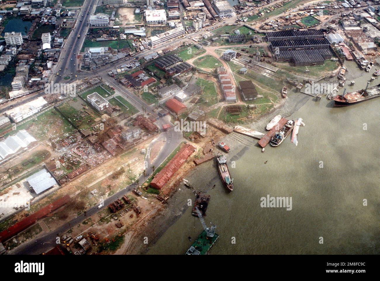 An aerial view of damage sustained by a port area in the aftermath of a ...