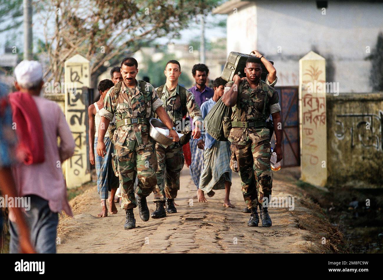 A U.S. military medical team arrives to assist the sick and injured in ...
