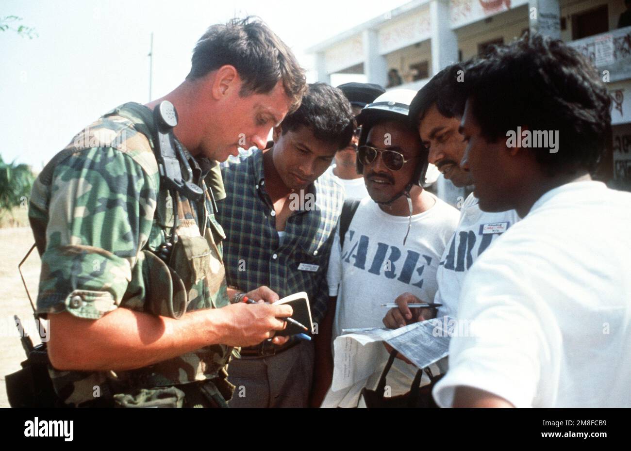 TECH. SGT. K.J. Jones coordinates relief efforts wsith C.A.R.E ...