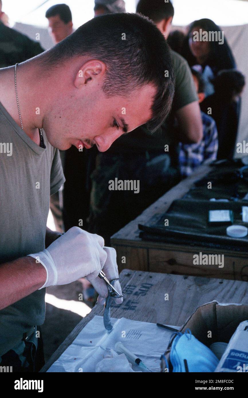 Dr. (LT) Donald R. Ratliff, a dentist with the 24th Marine ...