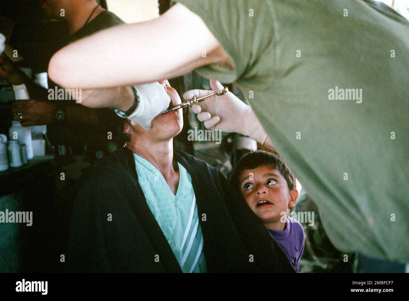 Dr. (LT) Donald R. Ratliff, a dentist with the 24th Marine ...
