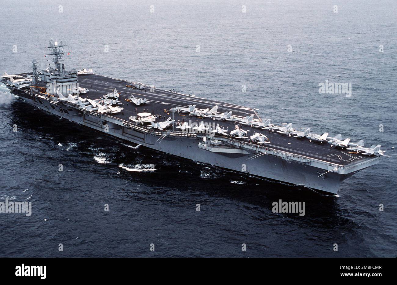 A starboard bow view of the nuclear-powered aircraft carrier USS ...