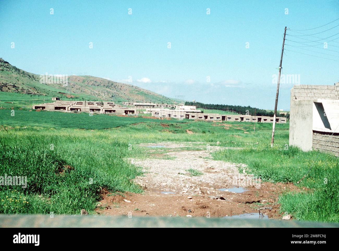 A view of empty buildings at a facility abandoned by the Iraqi army ...