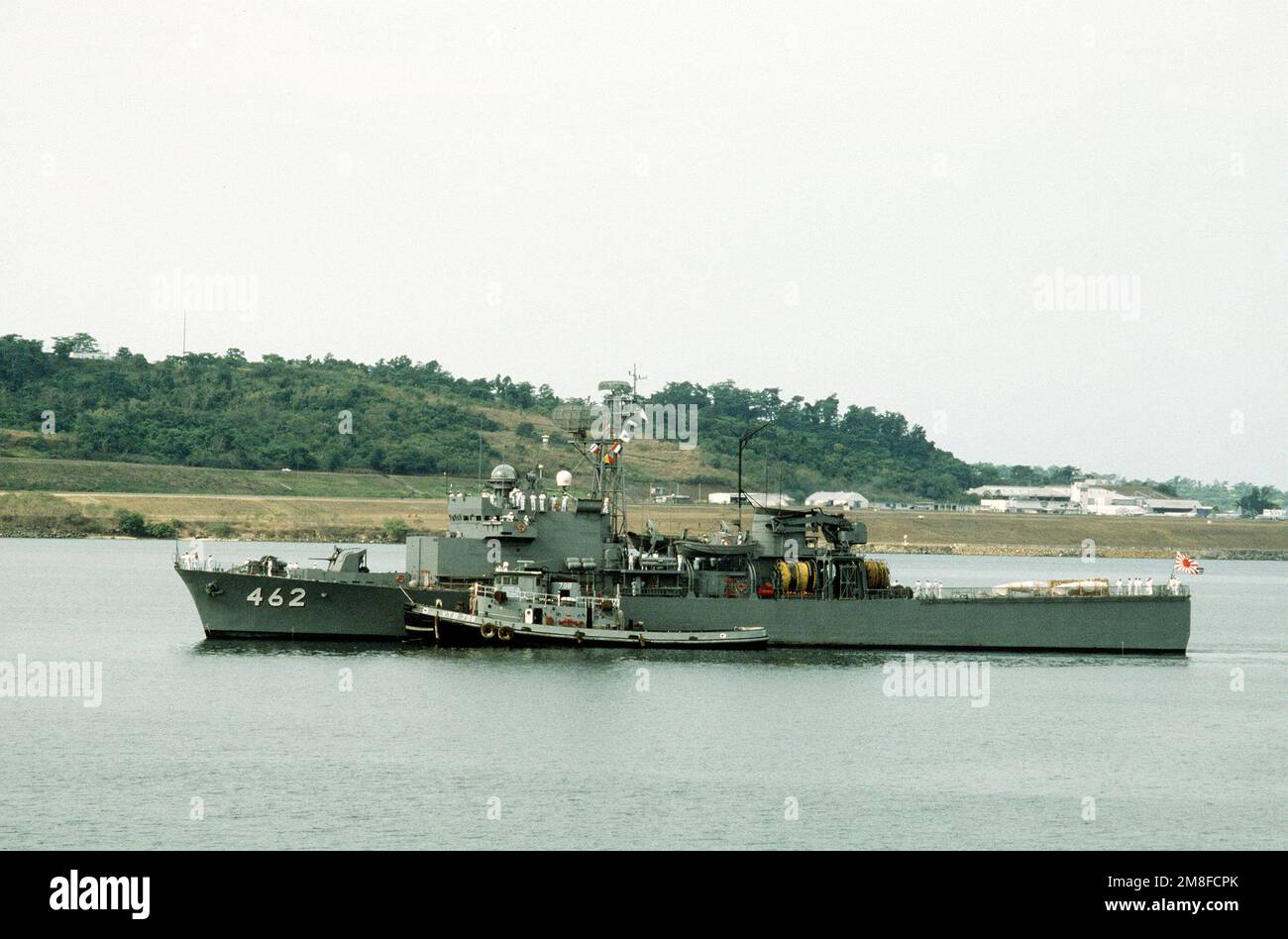 The large harbor tug OPELIKA (YTB-798) pulls the Japanese Maritime Self ...
