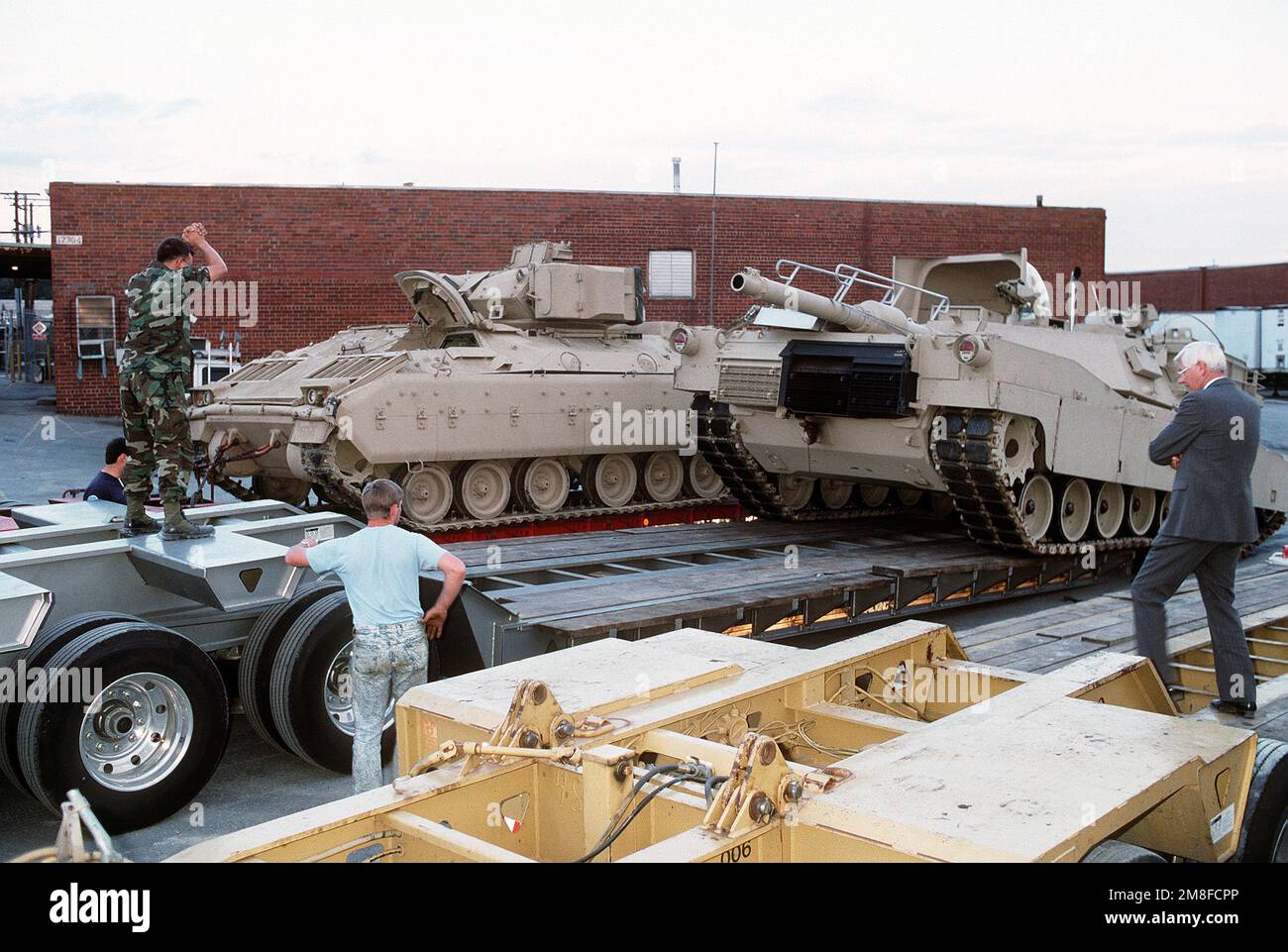 An M-1A1 Abrams main battle tank, right, and an M-3 Bradley cavalry ...