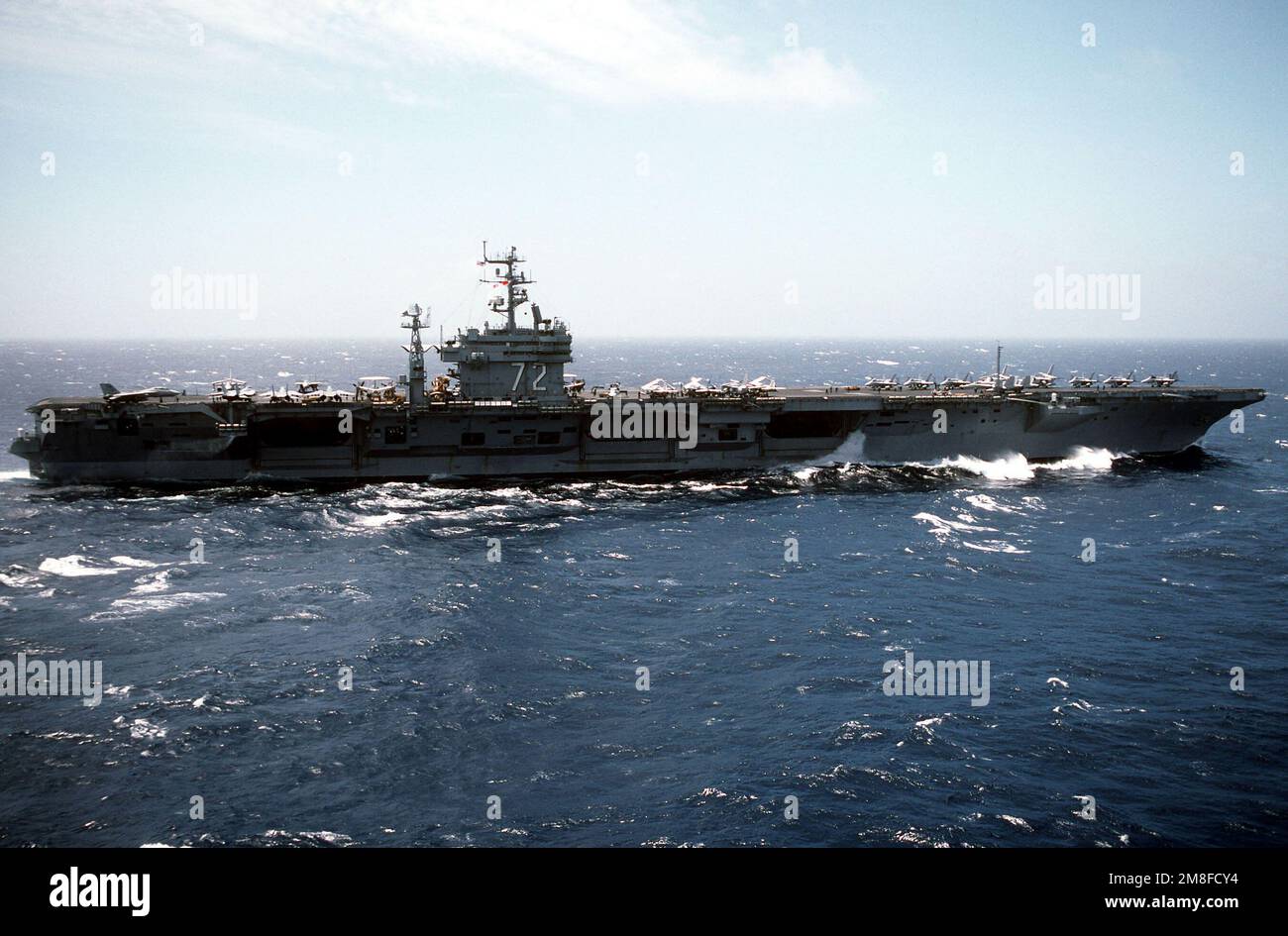 A starboard beam view of the nuclear-powered aircraft carrier USS ...