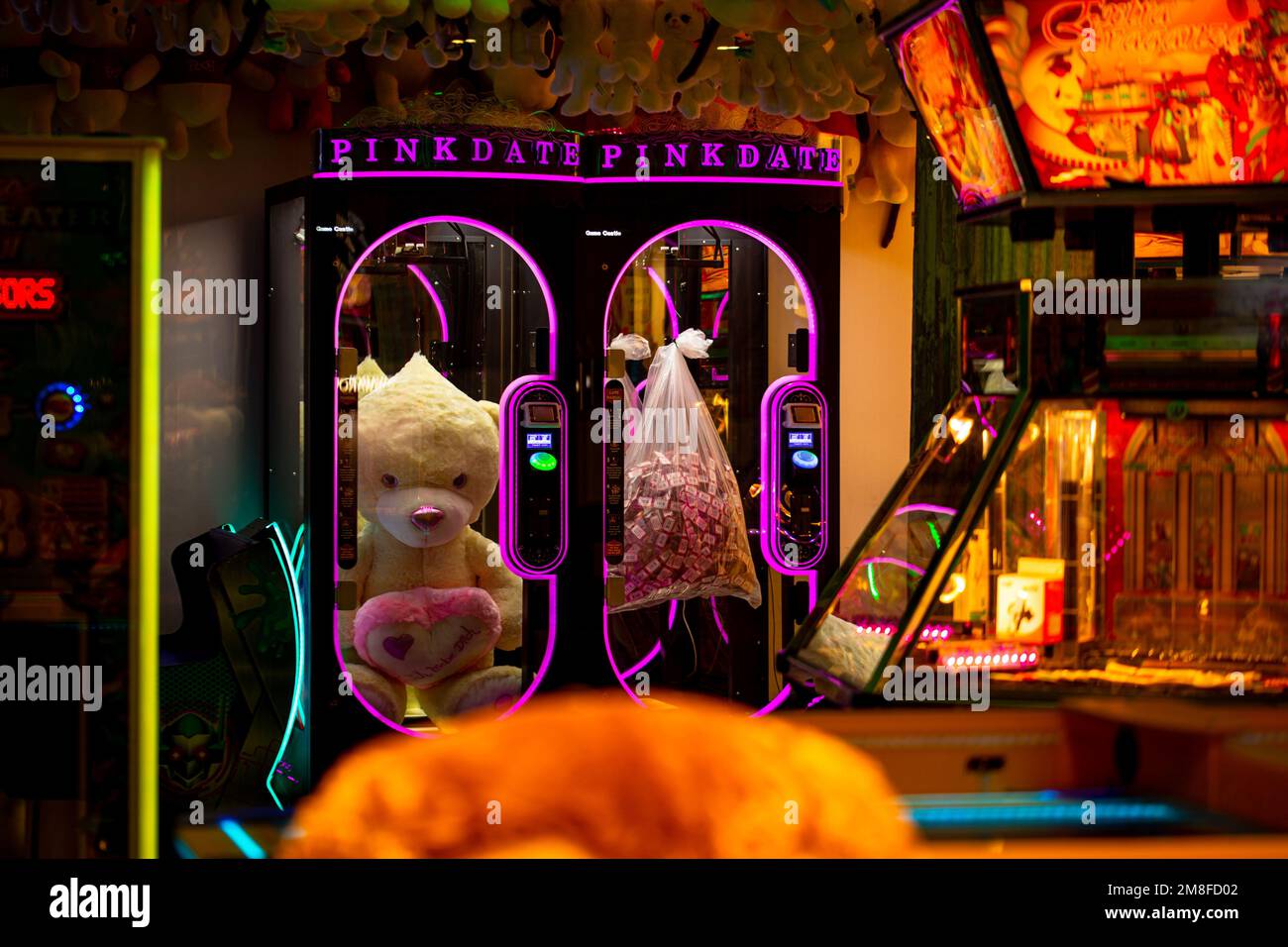 A store filled with different arcade games with different rewards Stock ...