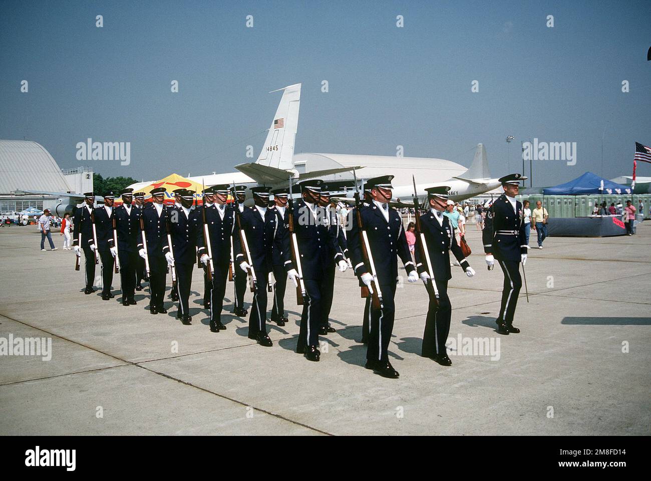 The U.S. Air Force Honor Guard Drill Team marches onto the flight line ...