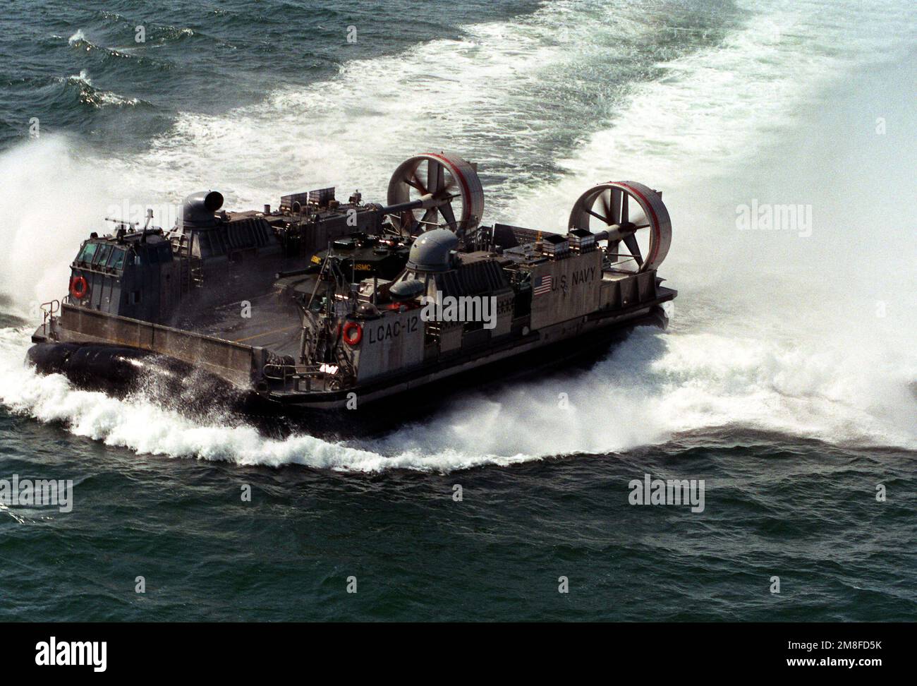 A Marine Corps M-1A1 Abrams tank is carrier toward the beach aboard the air cushion landing ...