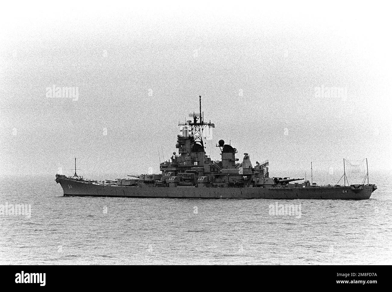 A port beam view of the battleship USS WISCONSIN (BB-64) on deployment ...
