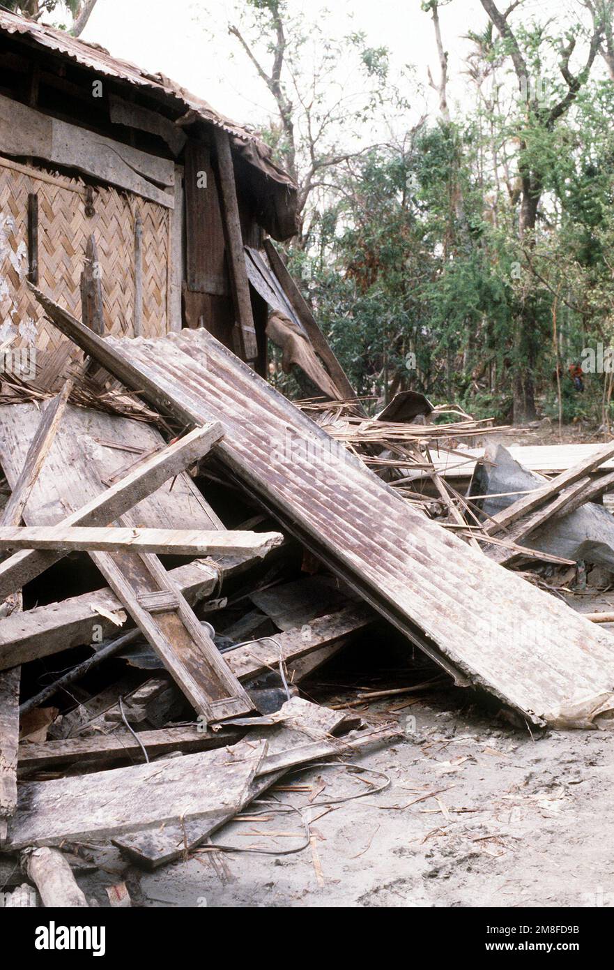 A wooden structure lies in ruins in the aftermath of a cyclone which ...