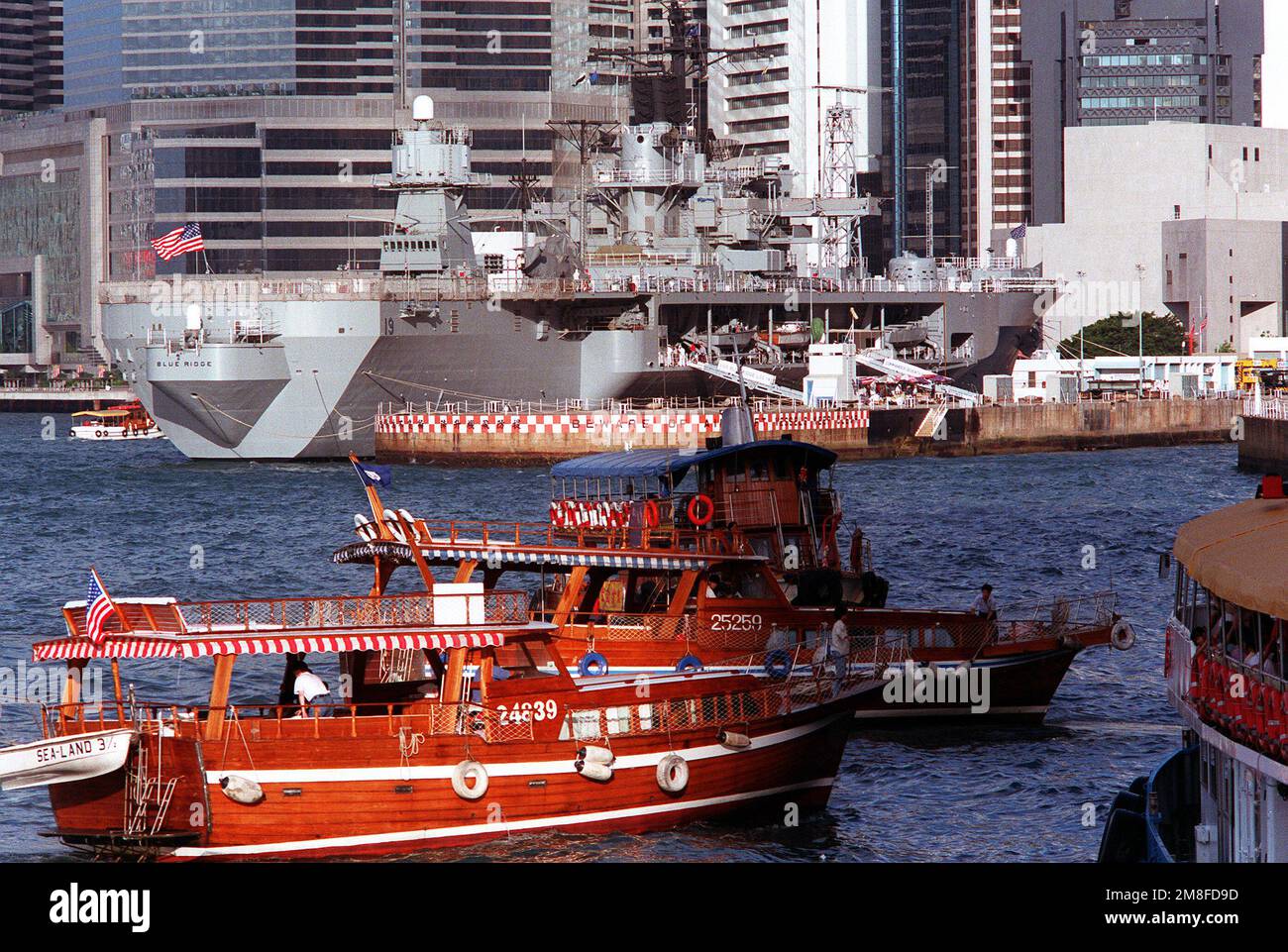 A starboard quarter view of the amphibious command ship USS BLUE RIDGE ...