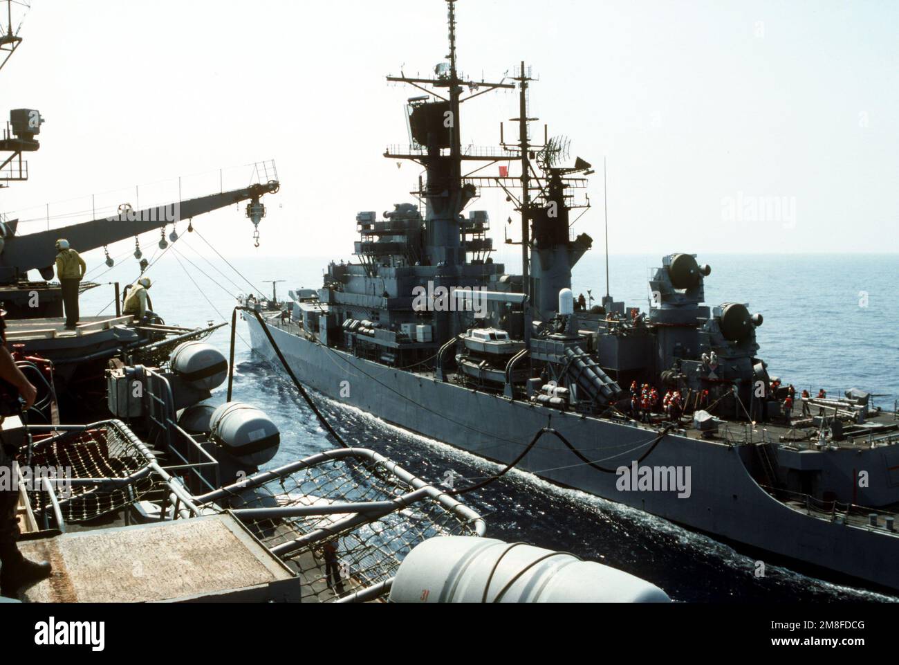 The guided missile cruiser USS RICHMOND K. TURNER (CG-20) steams alongside the amphibious ...