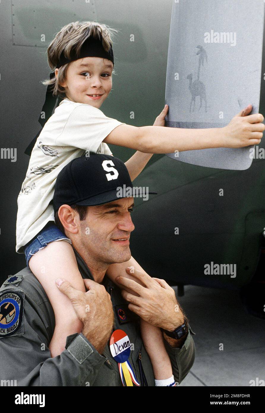 Devan Mitchell sits atop the shoulders of a member of the 8th Special ...