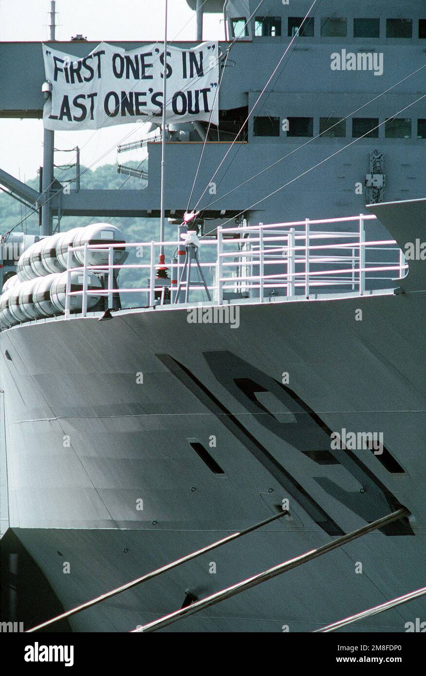 The amphibious command ship USS BLUE RIDGE (LCC-19) is moored to a pier ...