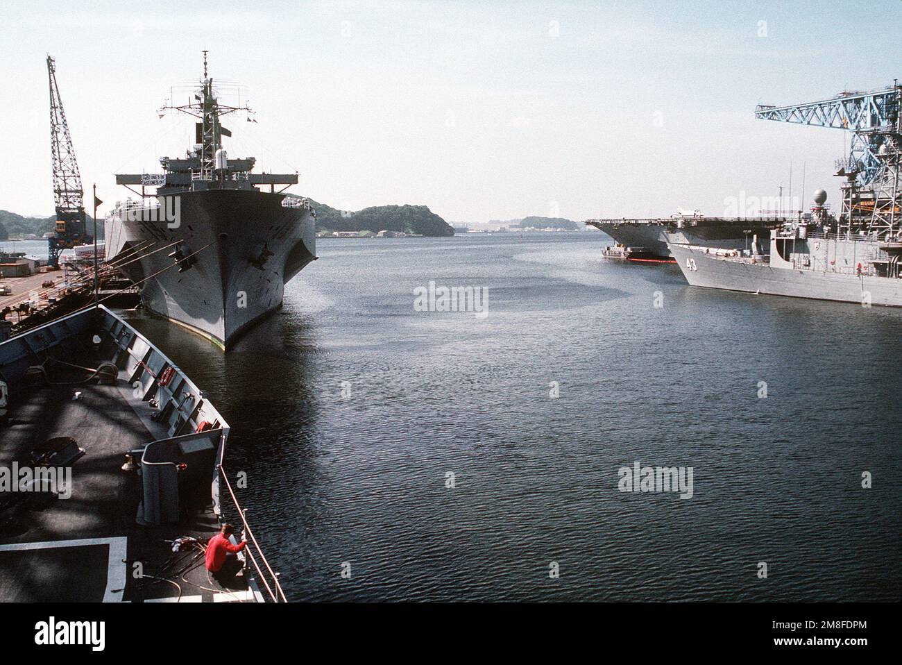 The amphibious command ship USS BLUE RIDGE (LCC-19) is moored to a pier ...