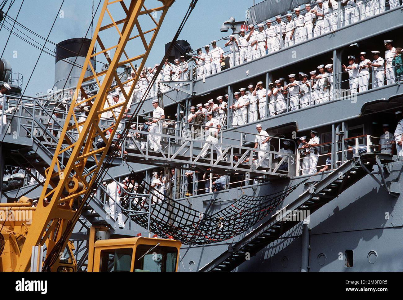 Crew members begin to depart from the repair ship USS JASON (AR-8 ...