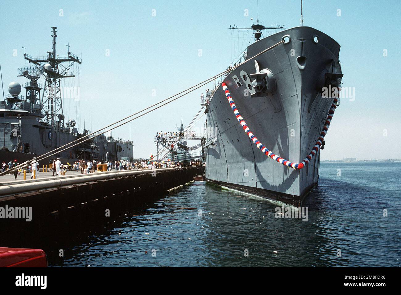 The repair ship USS JASON (AR-8) lies tied up at the pier after ...