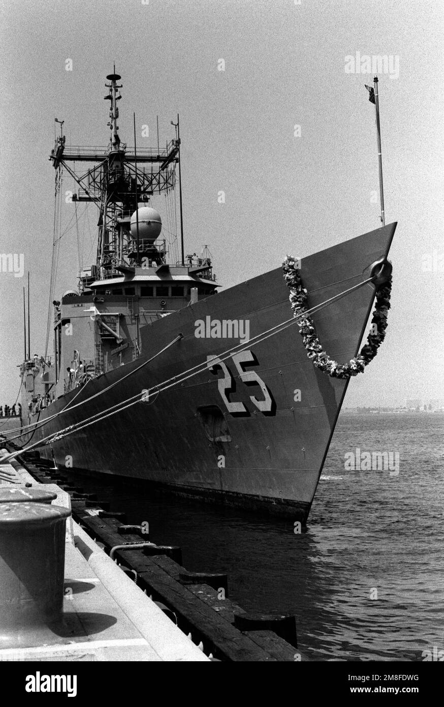 A garland decorates the bow of the guided missile frigate USS COPELAND ...