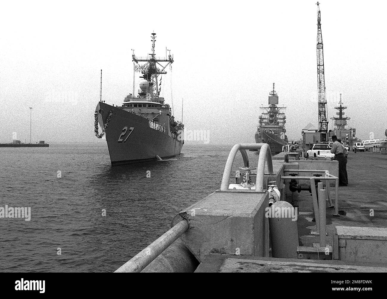 A garland hangs from the bow of the guided missile frigate USS MAHLON S ...