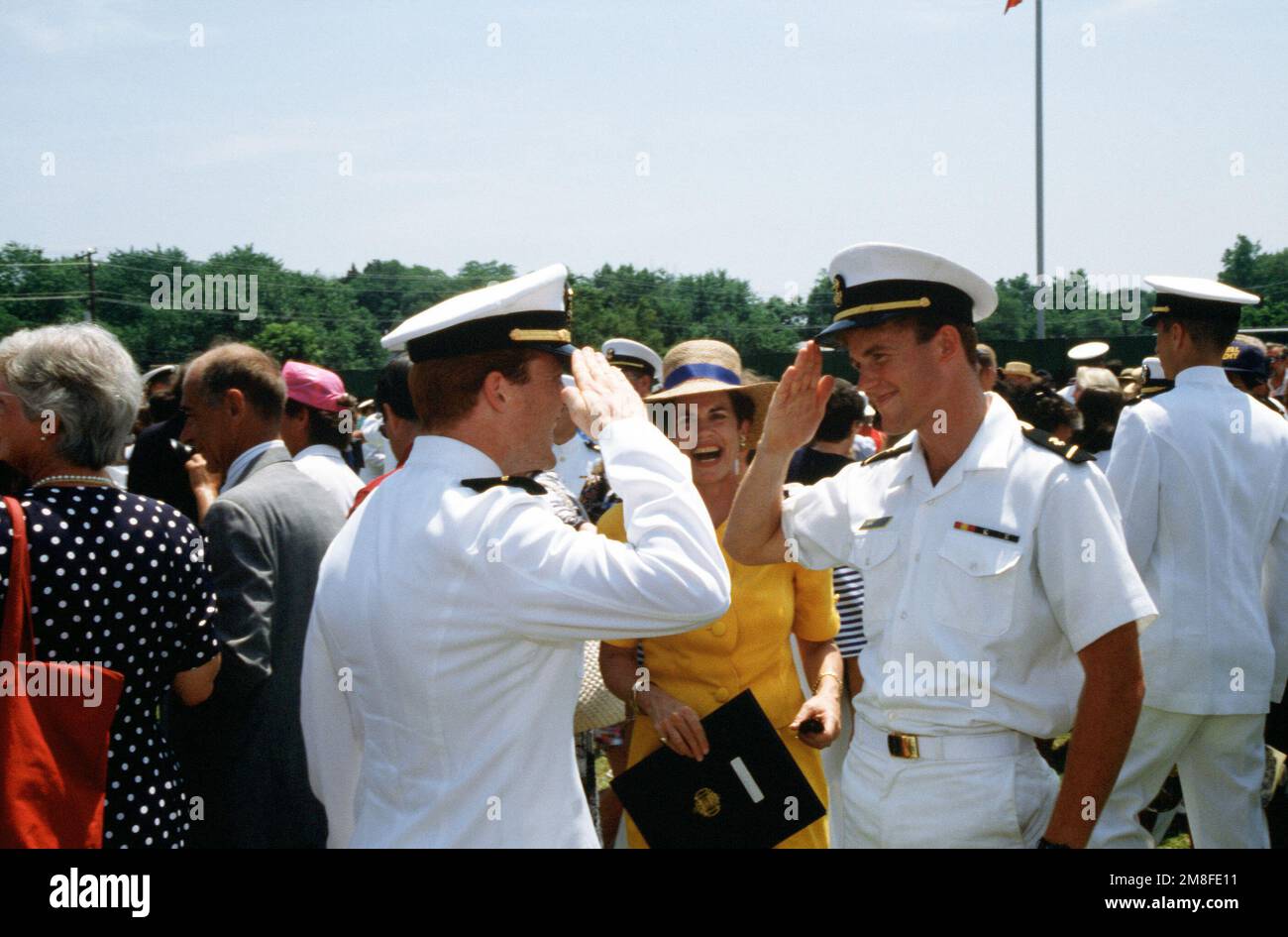 A newly commissioned ensign from the Naval Academy's Class of 1991 ...