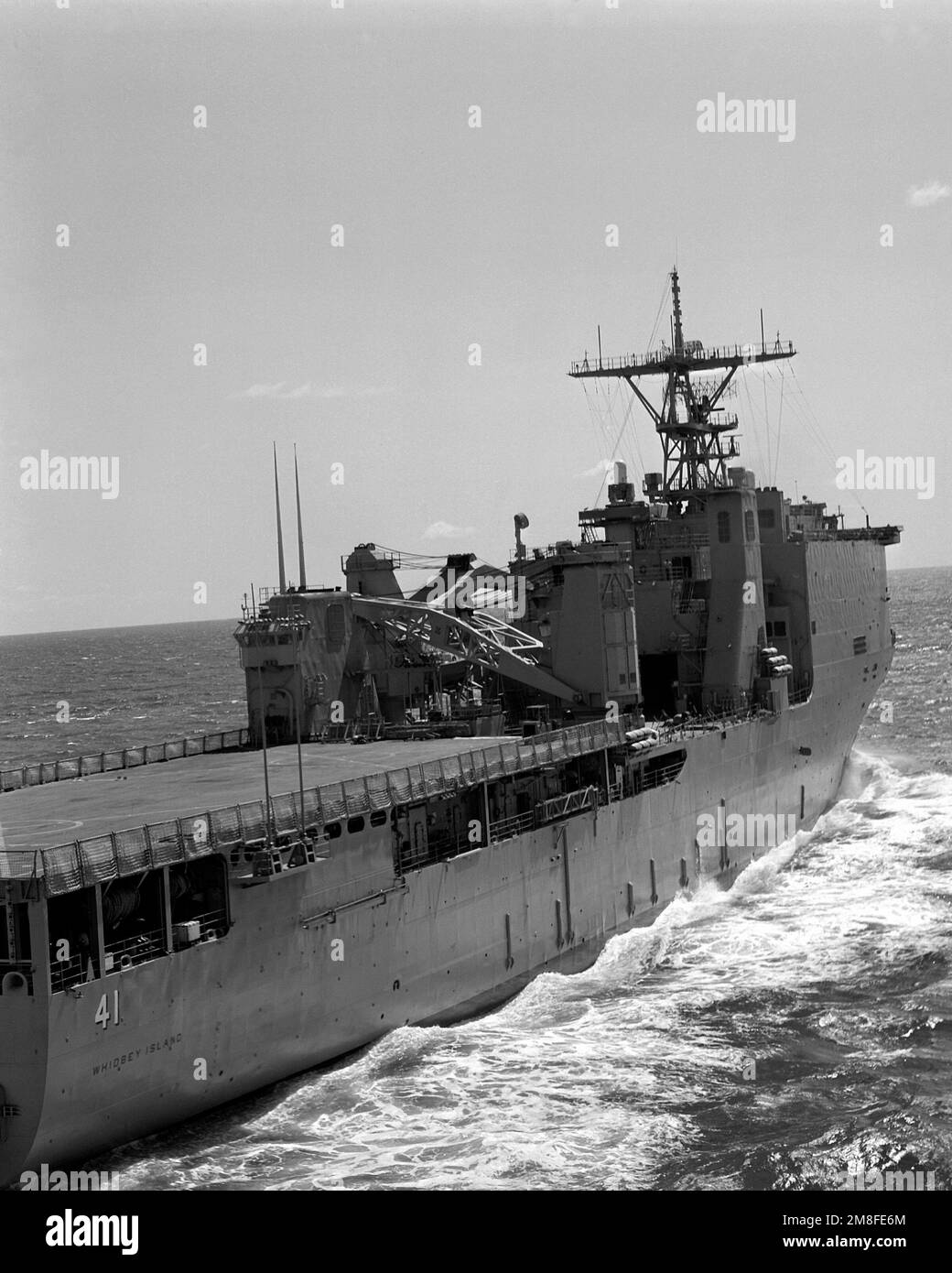 A starboard quarter view of the dock landing ship USS WHIDBEY ISLAND ...
