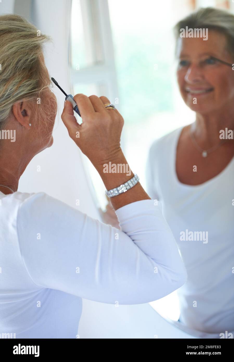 Getting ready for the family to arrive. A delighted senior woman ...