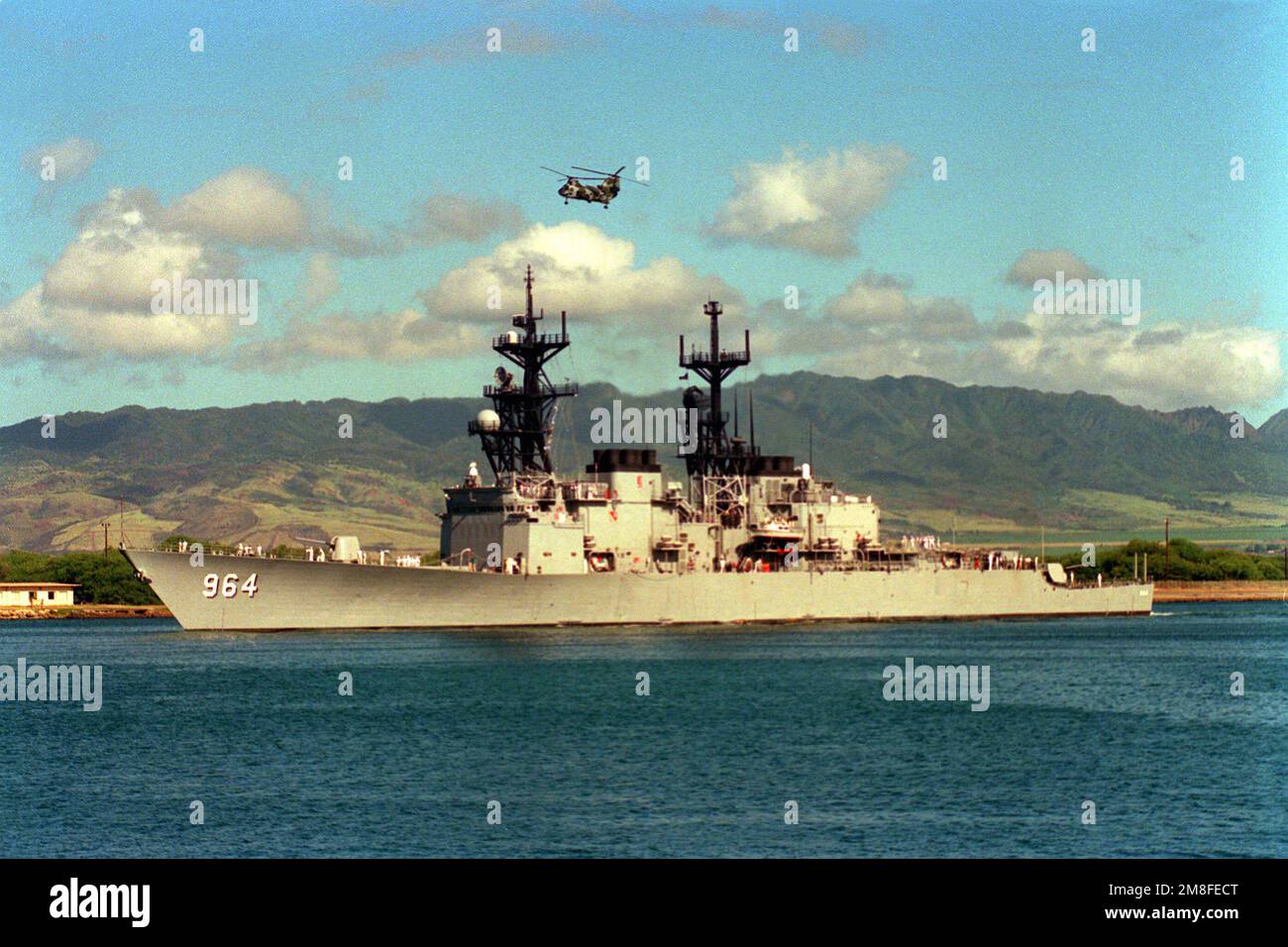 A U.S. Marine Corps CH-46E Sea Knight helicopter flies over the ...