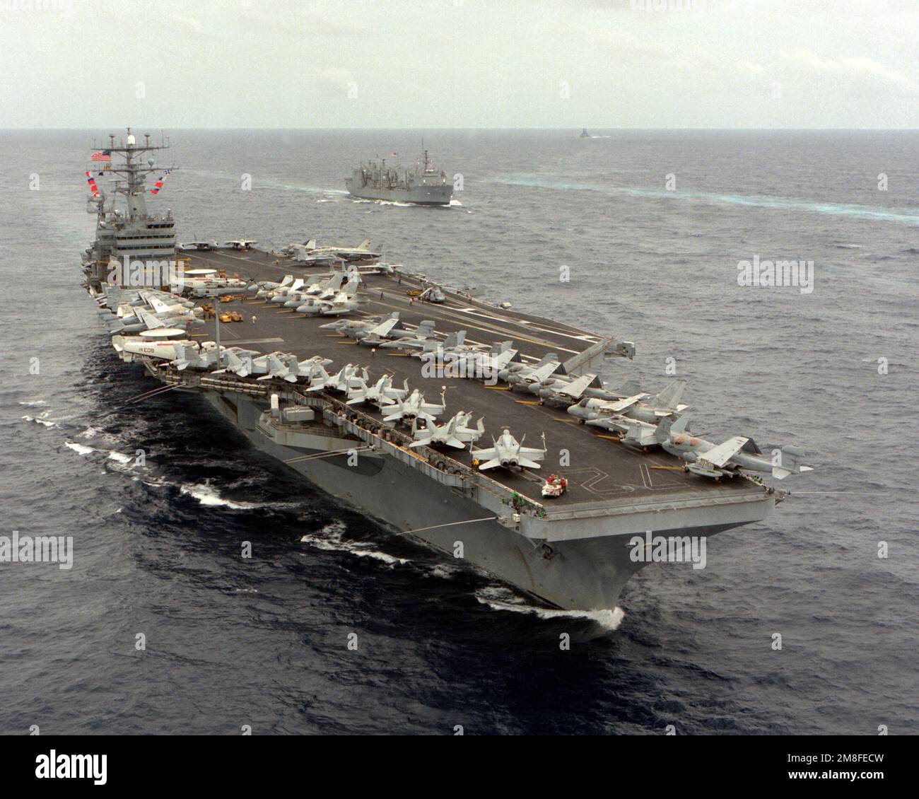 A starboard bow view of the nuclear-powered aircraft carrier USS ABRAHAM LINCOLN (CVN-72 ...