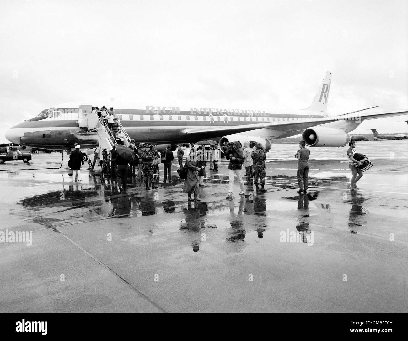 Evacuees from Clark Air Base and Naval Station, Subic Bay, disembark ...
