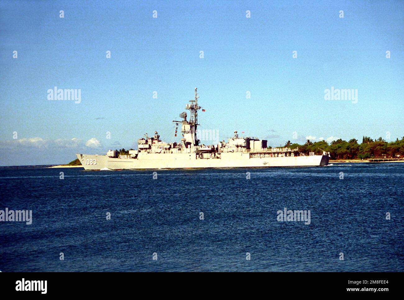A port beam view of the frigate USS COOK (FF-1083) departing Pearl ...
