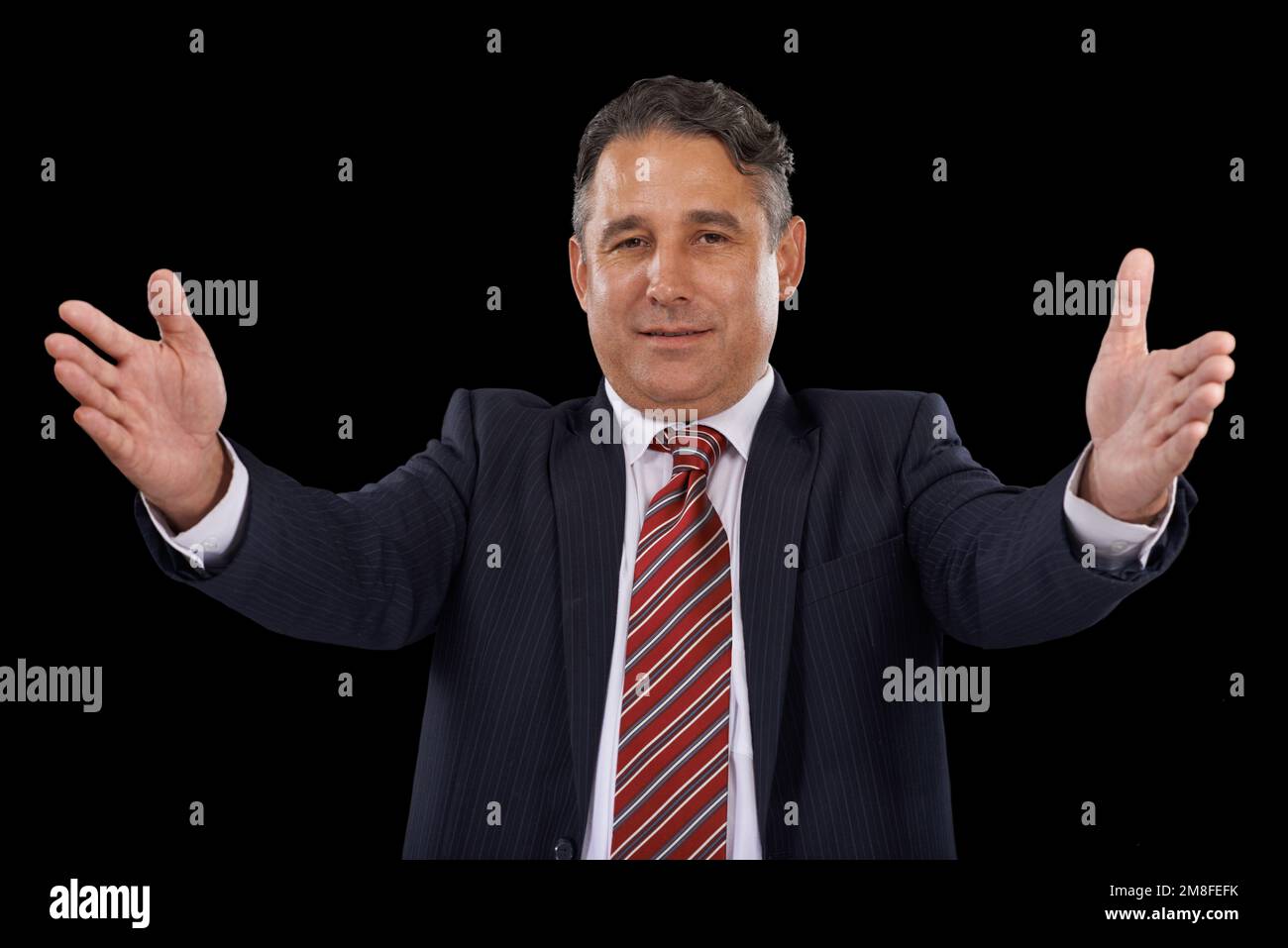 Welcoming you with open arms. Portrait of a man in a suit with his arms ...
