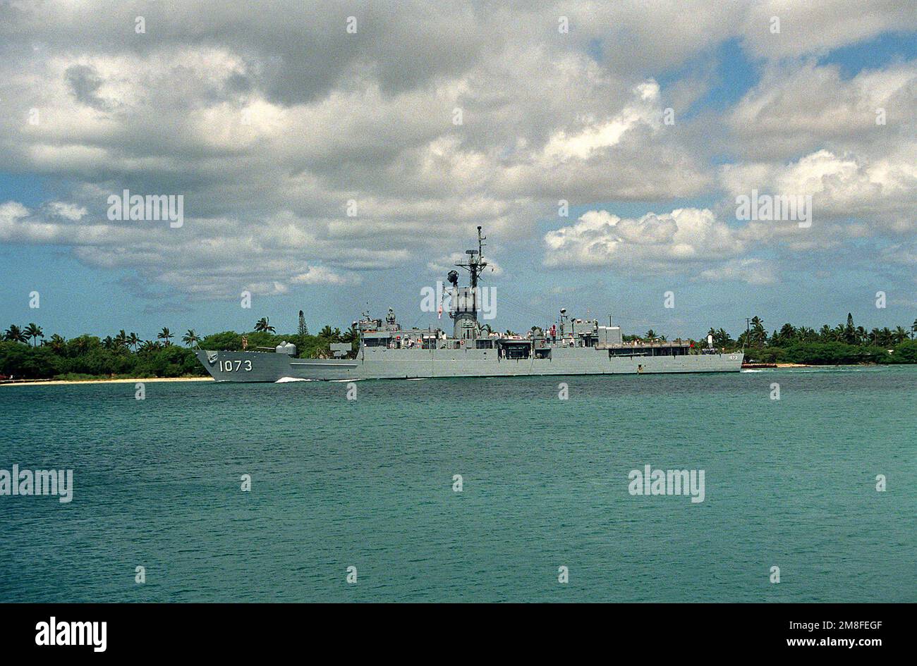 The frigate USS ROBERT E. PEARY (FF-1073) steams through the channel as ...