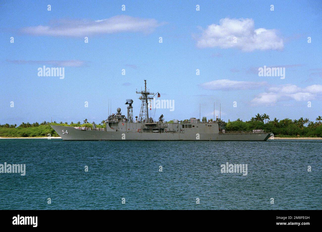 The guided missile frigate USS FORD (FFG-54) makes its way through the ...