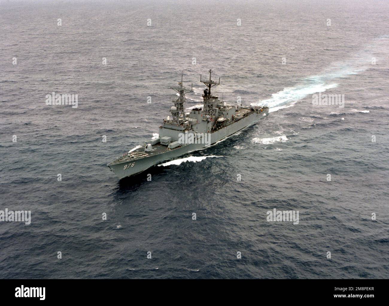 A port bow view of the destroyer USS MERRILL (DD-976) underway ...