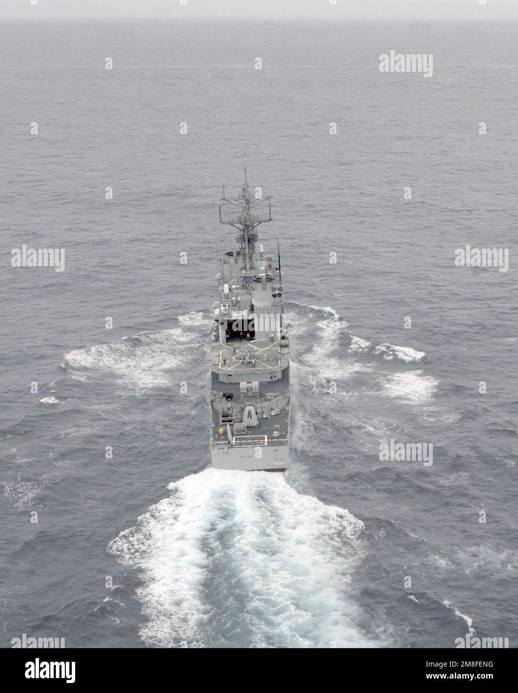 A stern view of the destroyer USS MERRILL (DD-976) underway.. Country ...