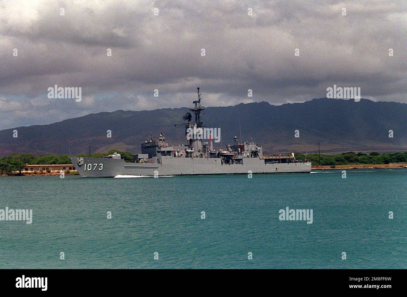 A port view of the frigate USS ROBERT E. PERRY (FF-1073) departing ...