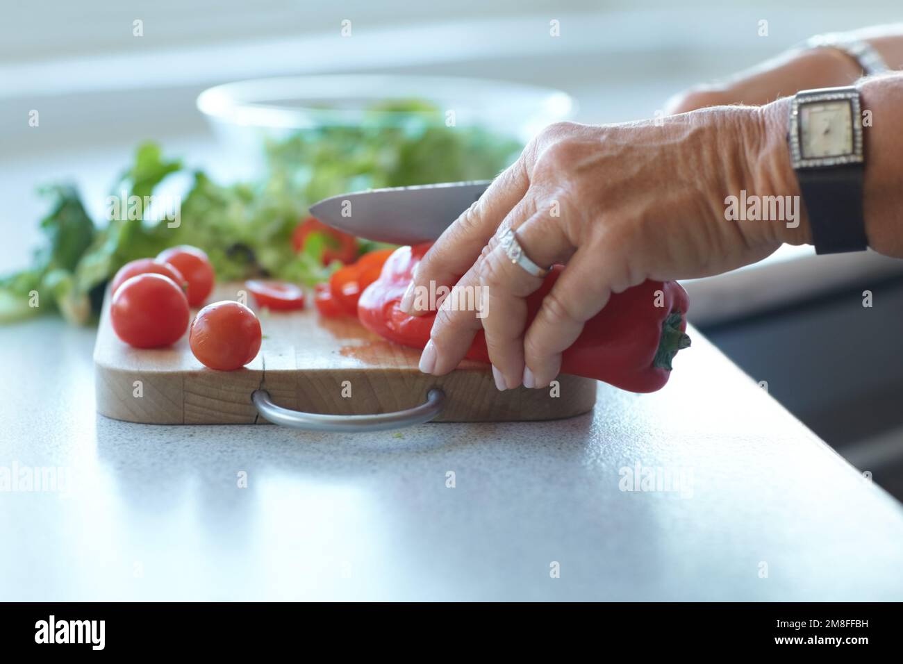Preparing the perfect healthy lunch. View of vegetables being chopped ...