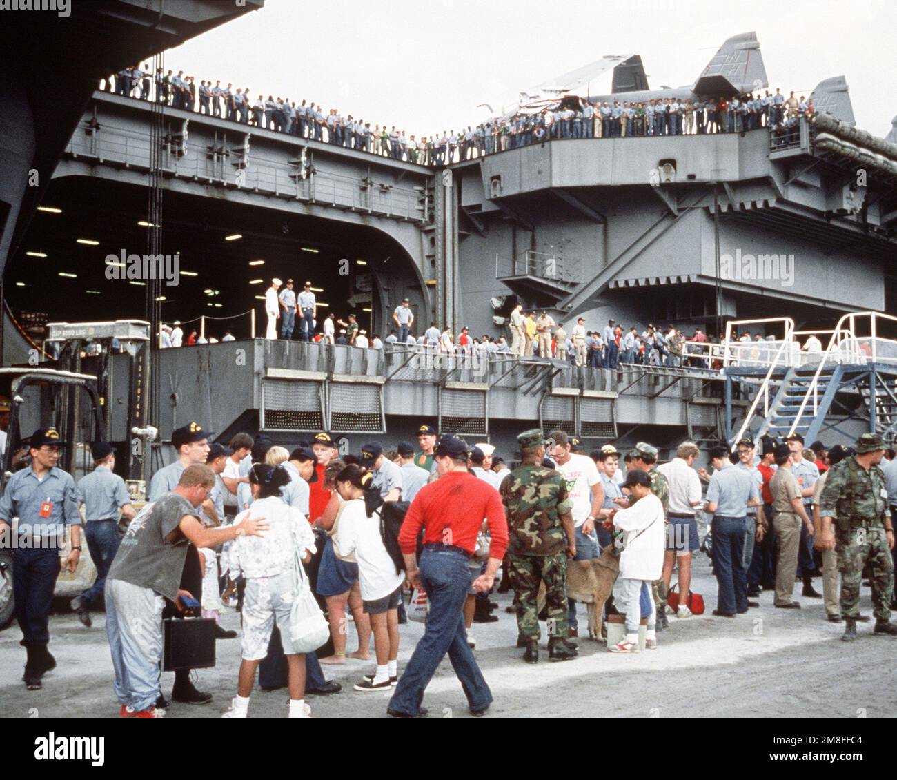 Military and civilian personnel board the nuclear-powered aircraft ...