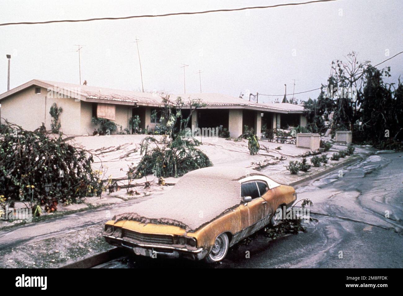Volcanic ash blankets a home and automobile in the base housing area in ...