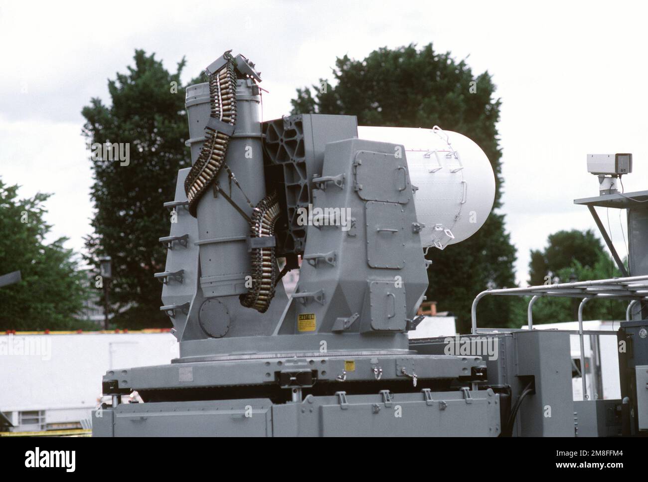 A Phalanx close-in weapons system (CIWS) displaying its ammunition belt ...