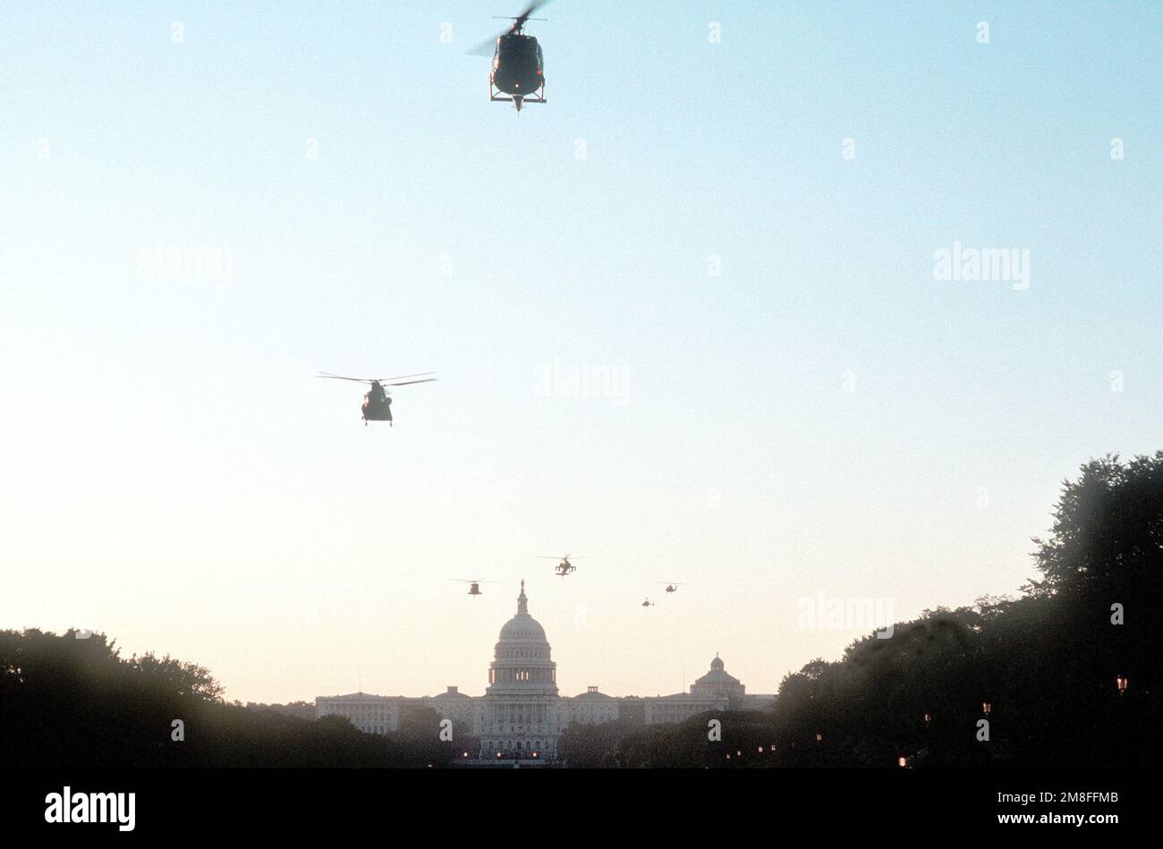 A CH-53 Sea Stallion helicopter prepares to touch down on the Mall near ...