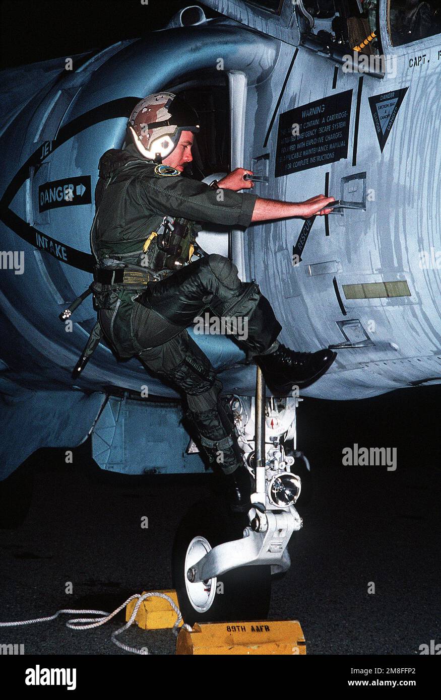 CAPT. Hall, a pilot from Marine Attack squadron 231 (VMA-231), climbs ...