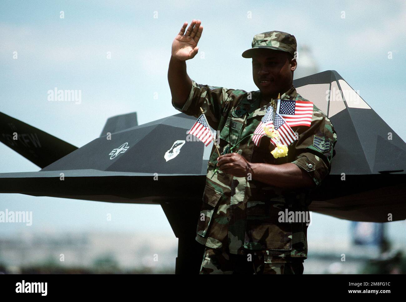 A U.S. Air Force crewchief and a model of a F-117A Stealth aircraft are ...